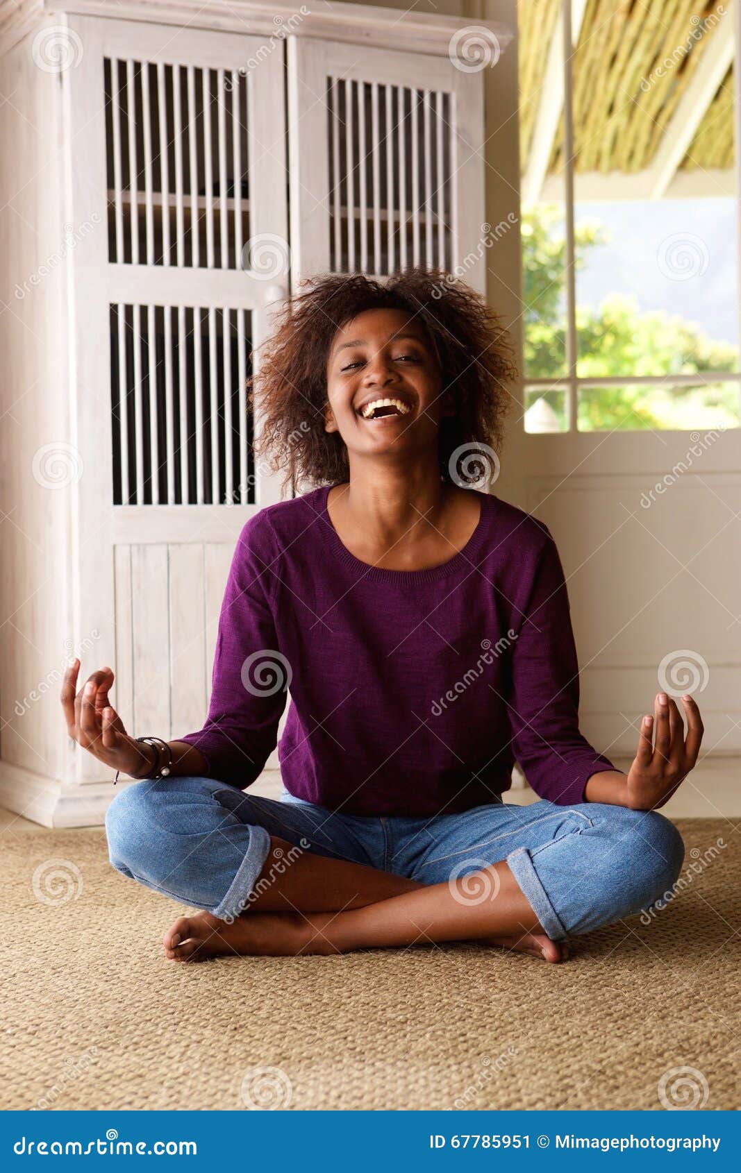 Smiling Young Black Woman Sitting On Floor Practising Yoga Stock Image