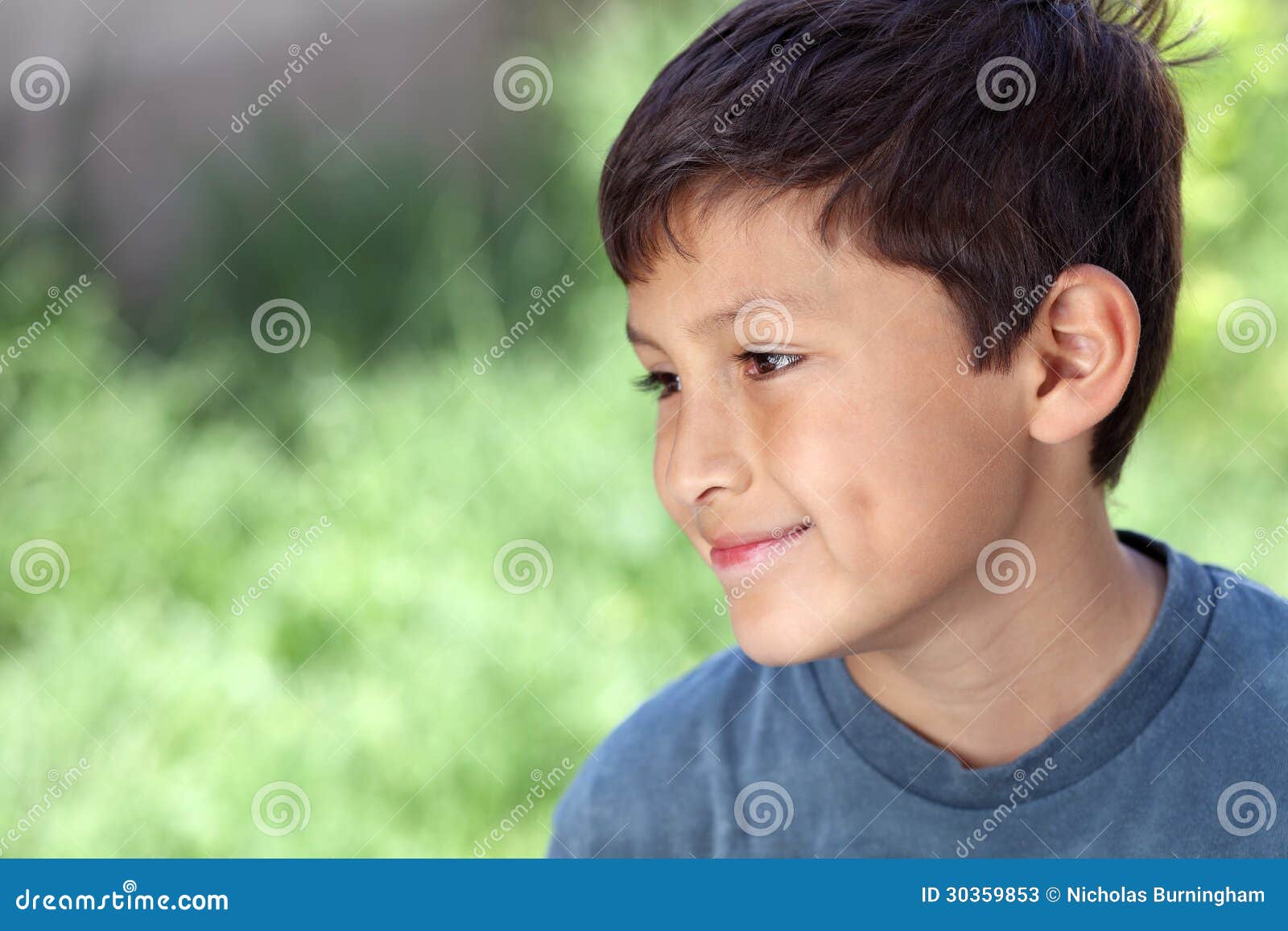 Smiling young boy outside stock image. Image of watching - 30359853
