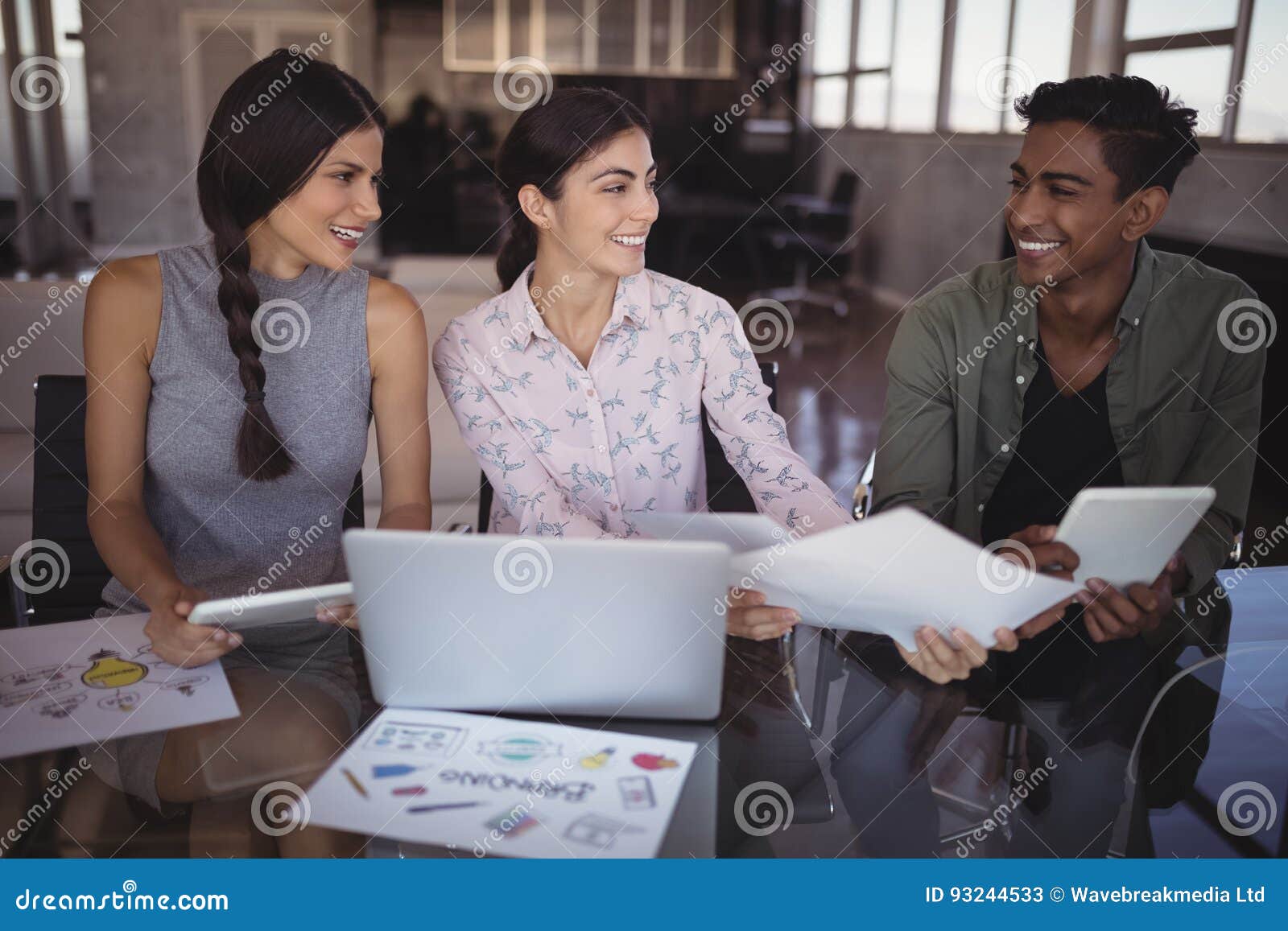 Smiling Young Business People Working Together at Office Stock Image ...