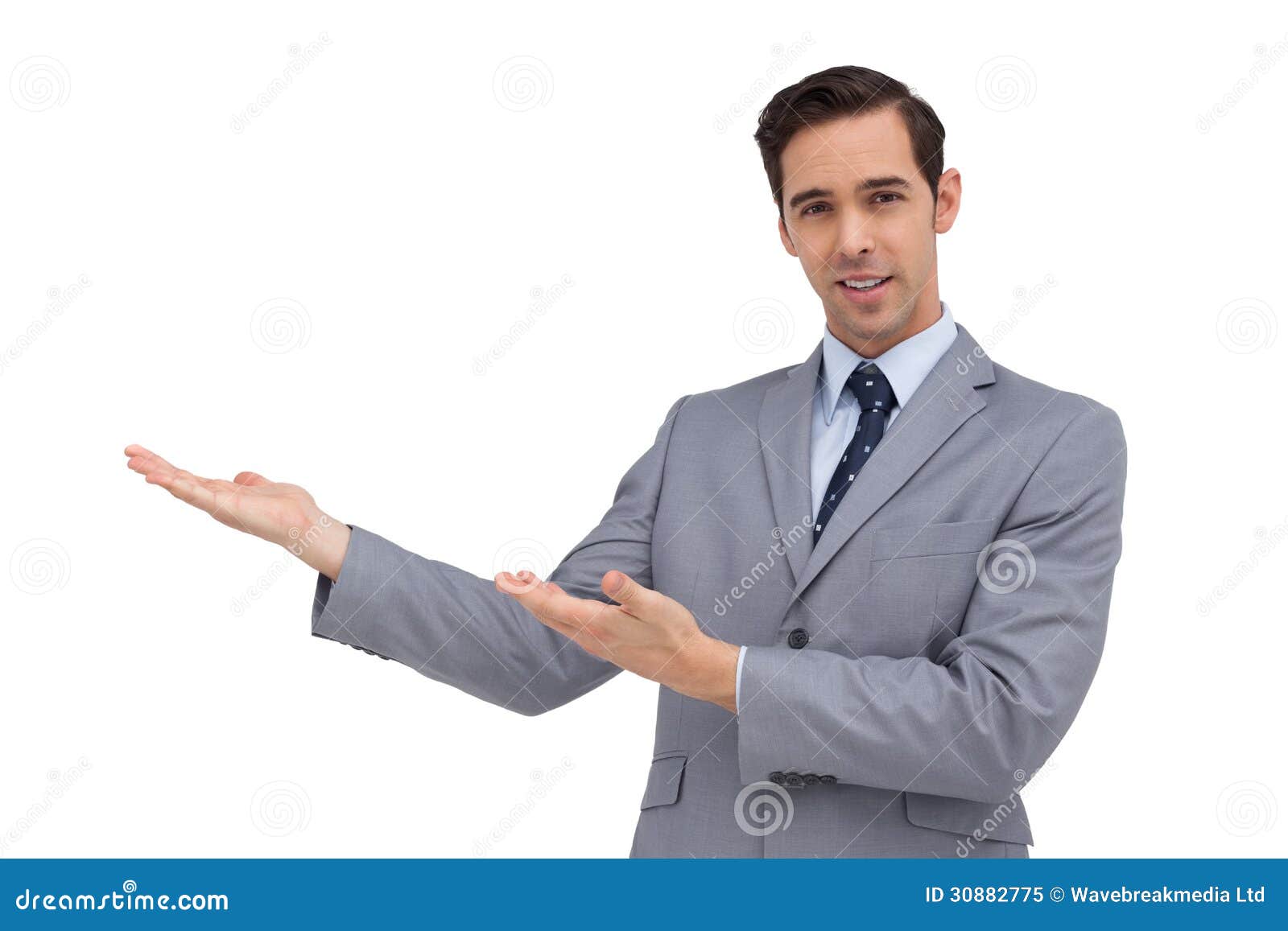 Smiling Young Businessman Giving a Presentation with His Hands Stock ...