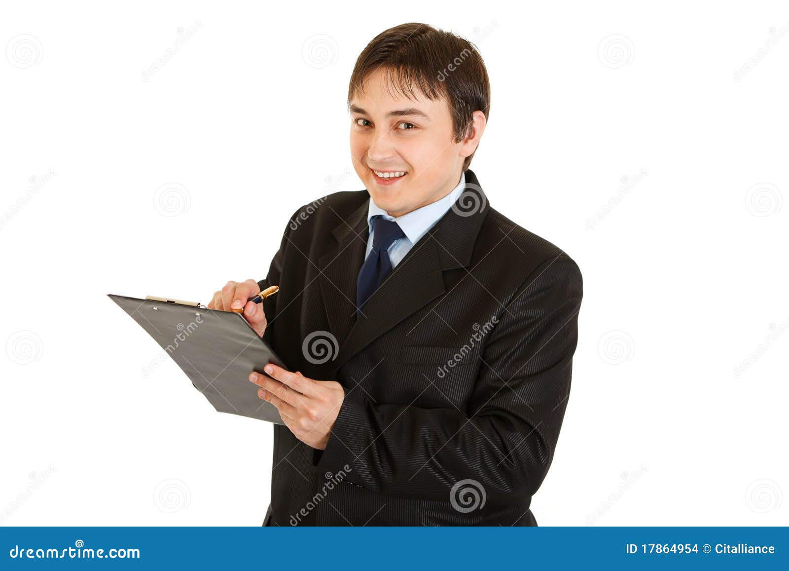 Smiling Young Businessman Making Notes in Document Stock Photo - Image ...