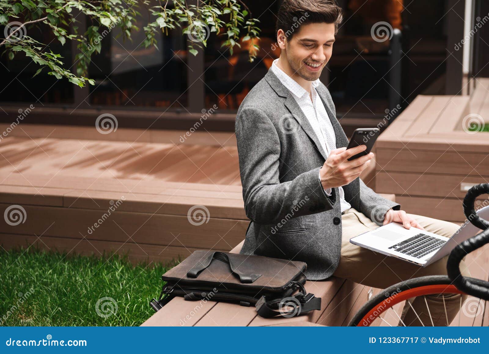 Smiling Young Businessman Using Mobile Phone Stock Image - Image of ... Smiling Young Businessman Using Mobile Phone Stock Image - Image of ...