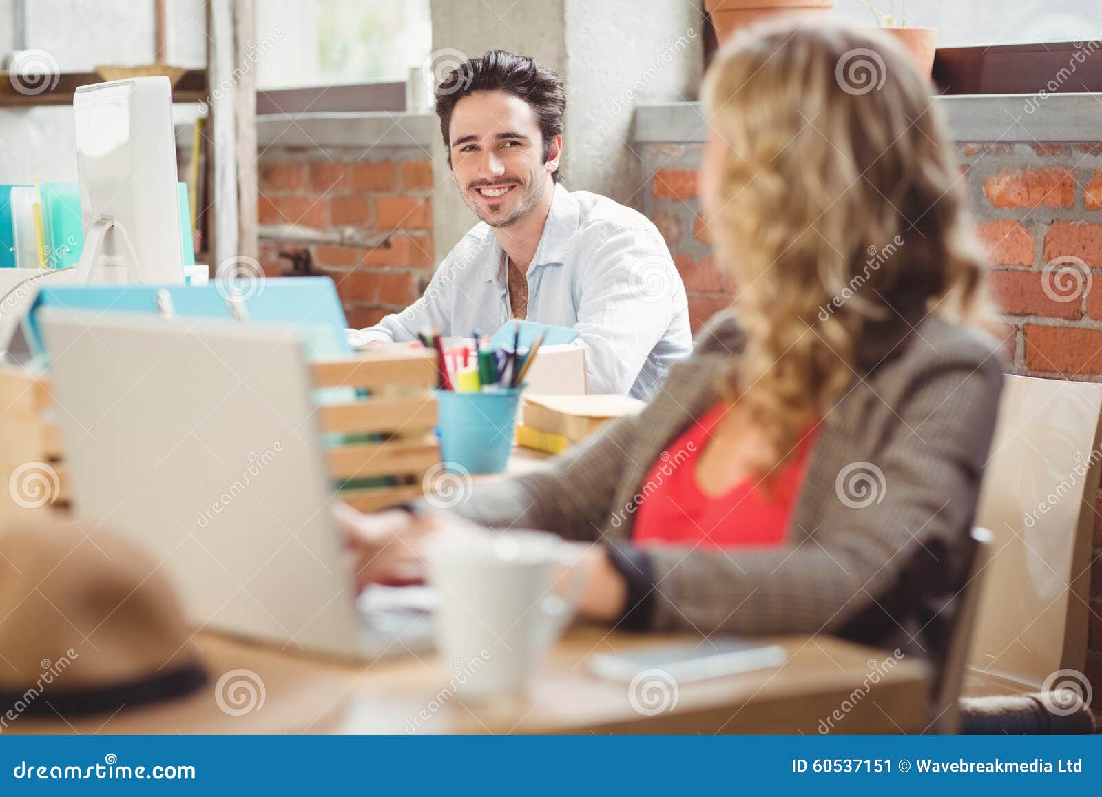 Smiling Young Businessman Working on Computer in Office Stock Image ...