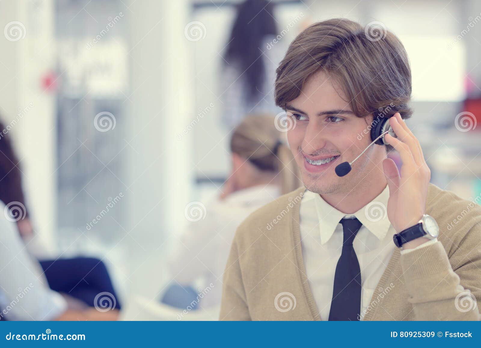 Smiling Young Call Center Executive at Startup Office Stock Image ...
