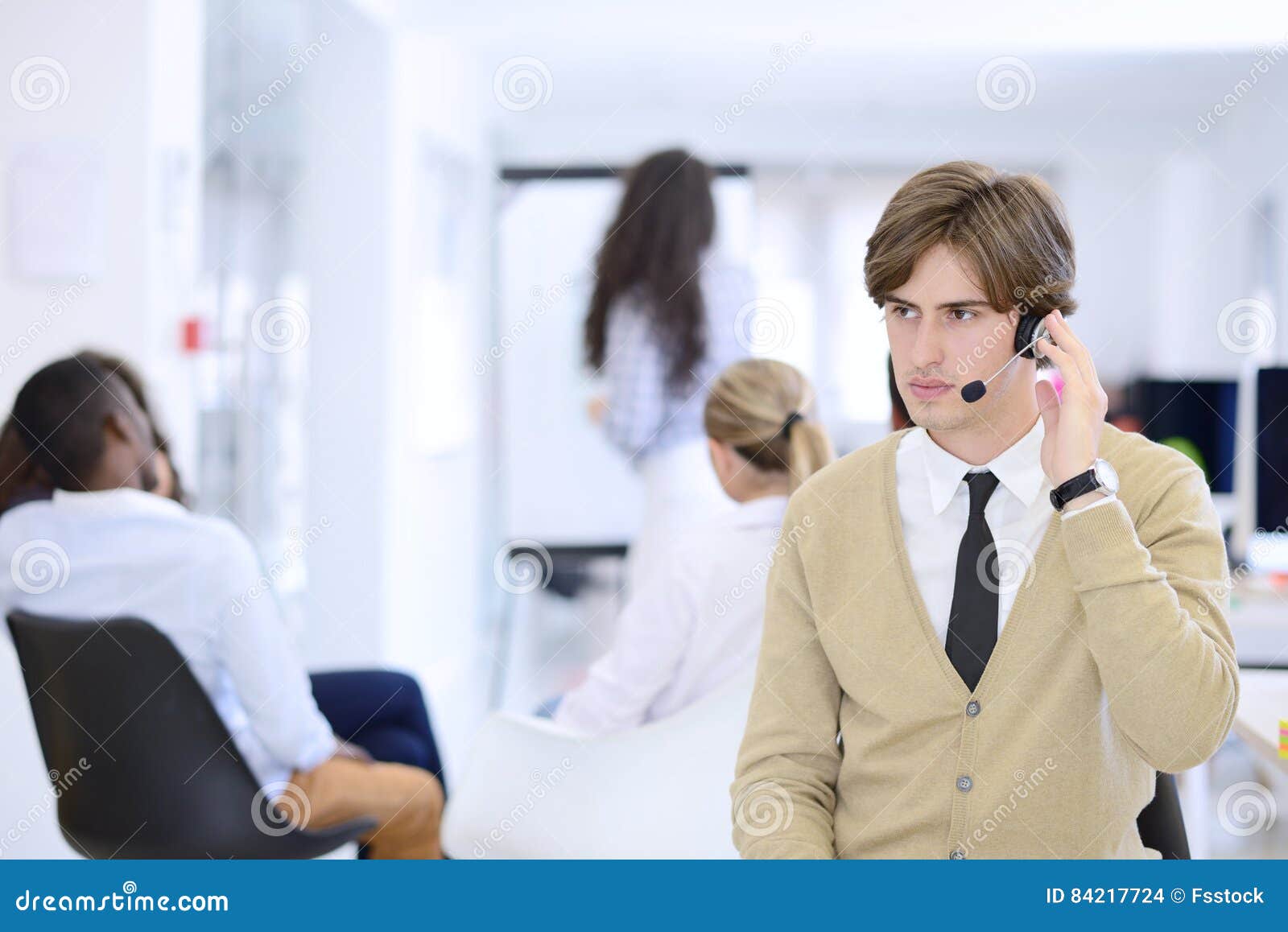 Smiling Young Call Center Executive at Startup Office Stock Photo ...