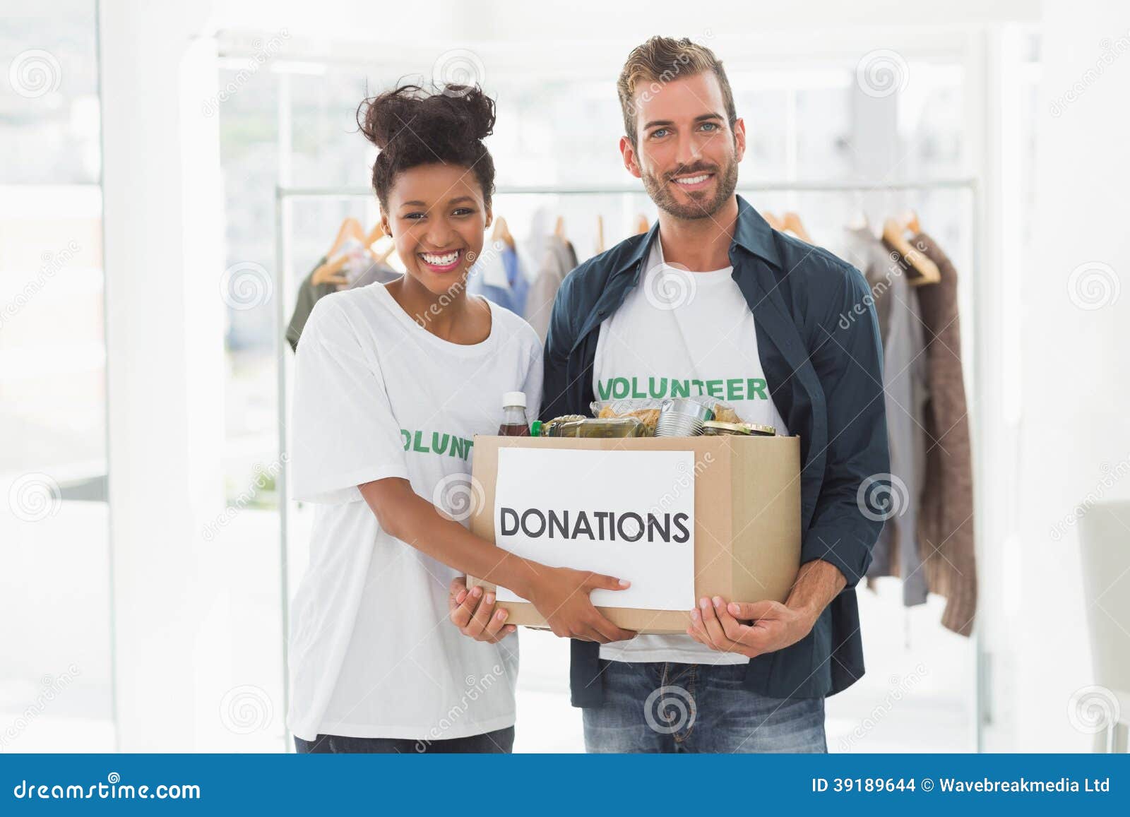 Smiling Young Couple with Clothes Donation Stock Photo - Image of ...