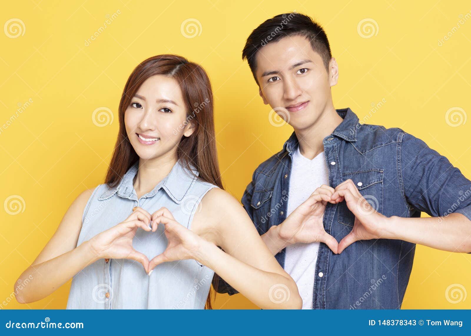 Young Couple with Heart Shape Hand Sign Stock Image - Image of ...