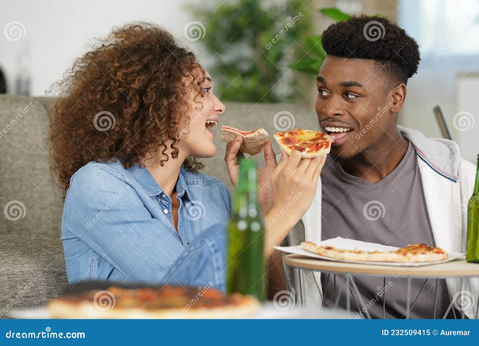 Smiling Young Couple with Pizza on Sofa at Home Stock Image - Image of ...