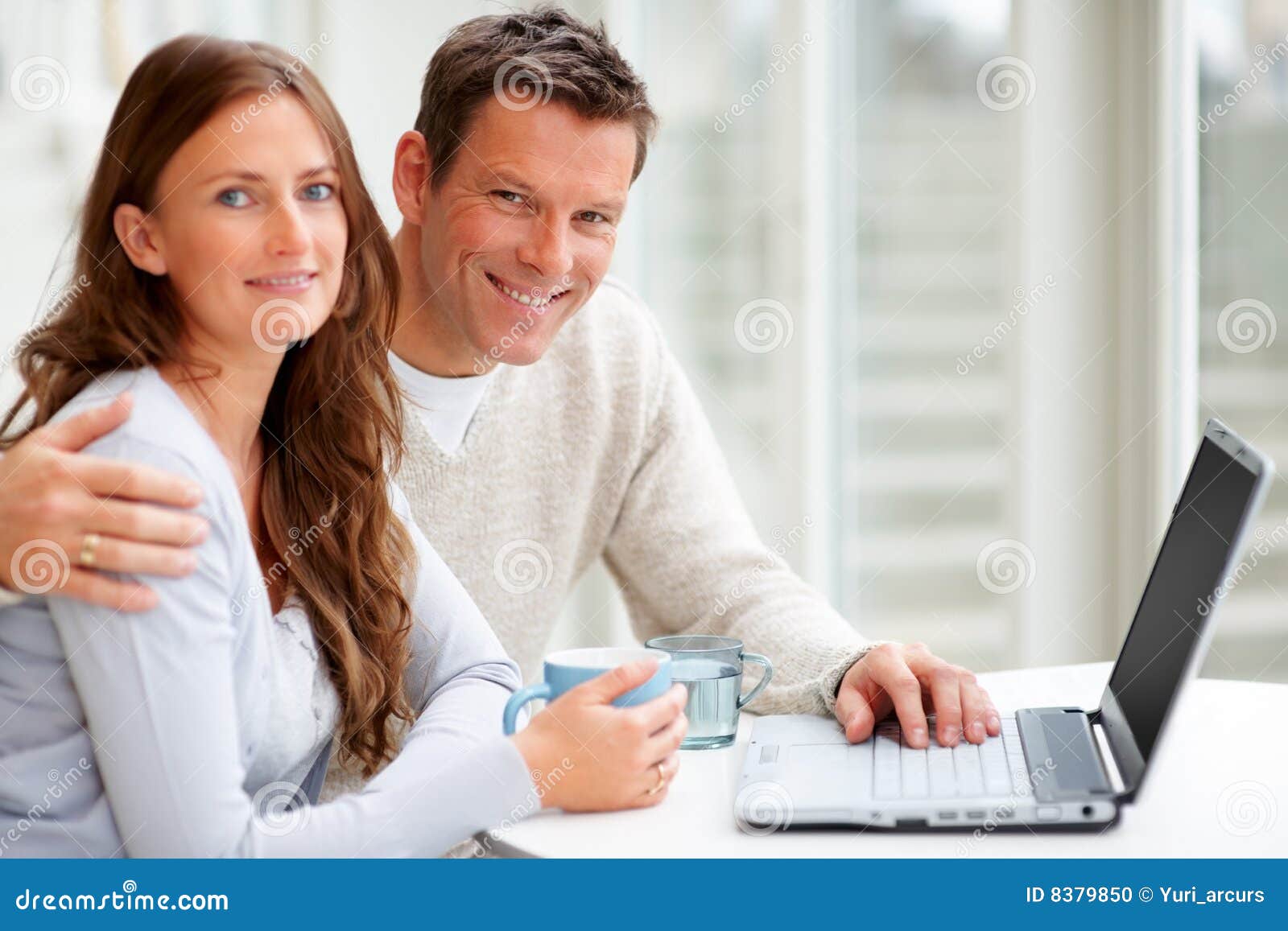 Smiling Young Couple Working on Laptop Together Stock Photo - Image of ...