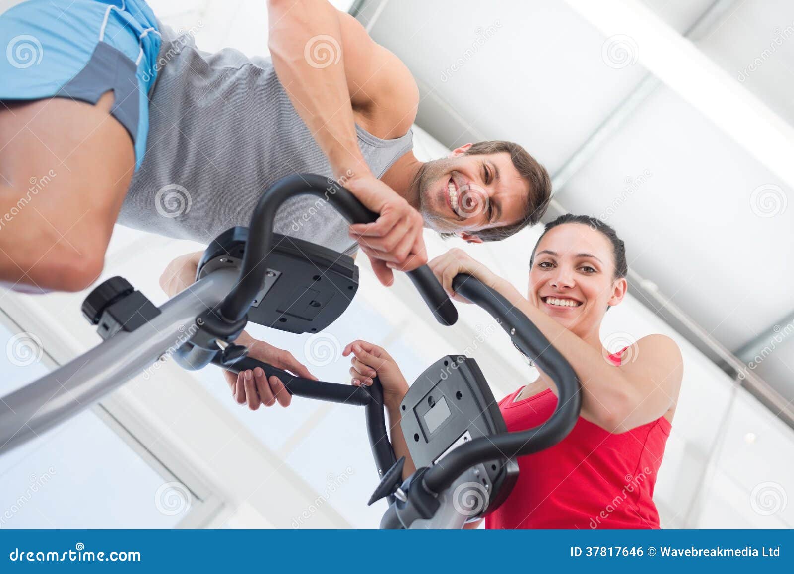 Smiling Young Couple Working Out at Spinning Class Stock Photo - Image ...