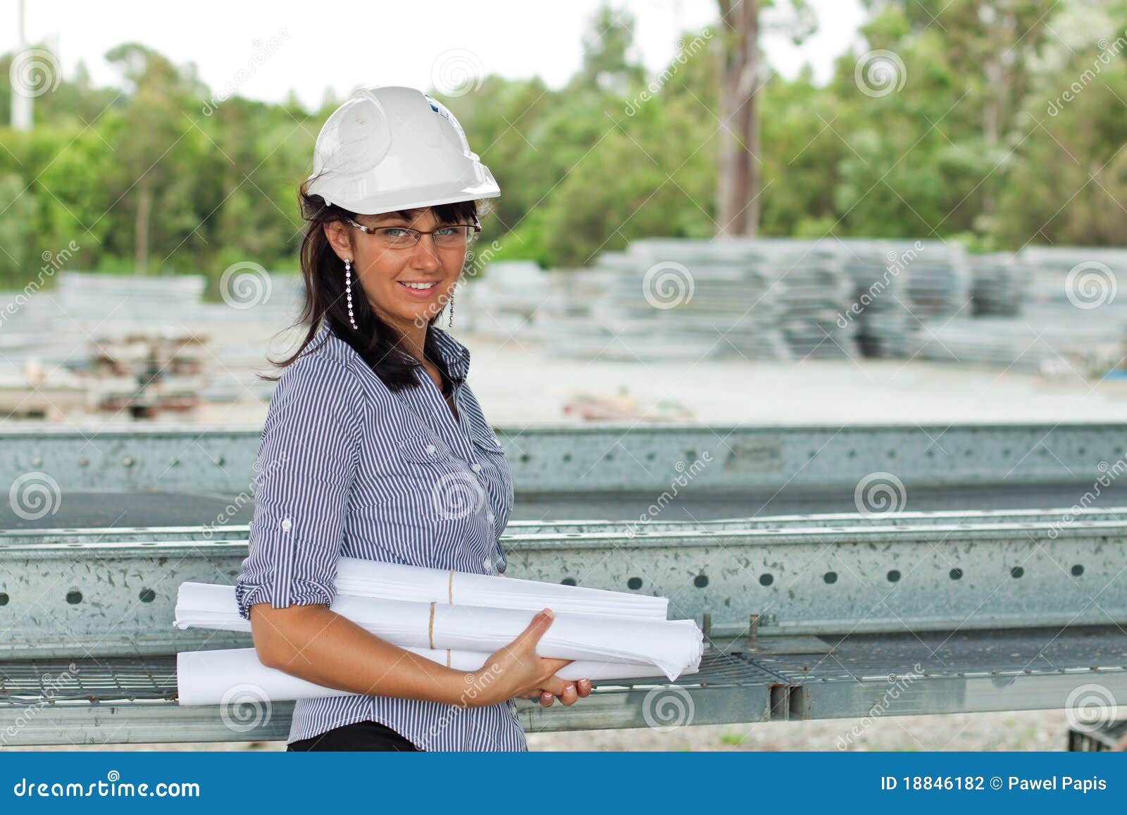 Smiling Young Engineer Woman with Rolled Drawings Stock Photo - Image ...