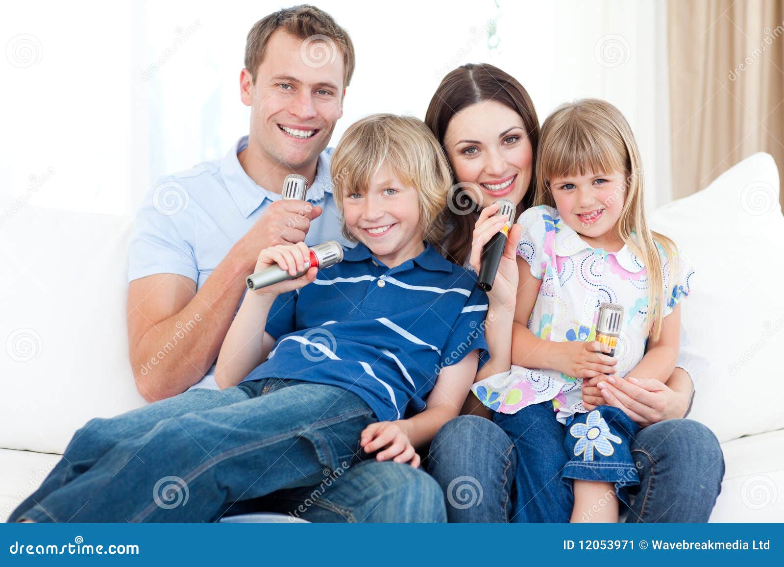 Smiling Young Family Singing a Karaoke Together Stock Image - Image of ...