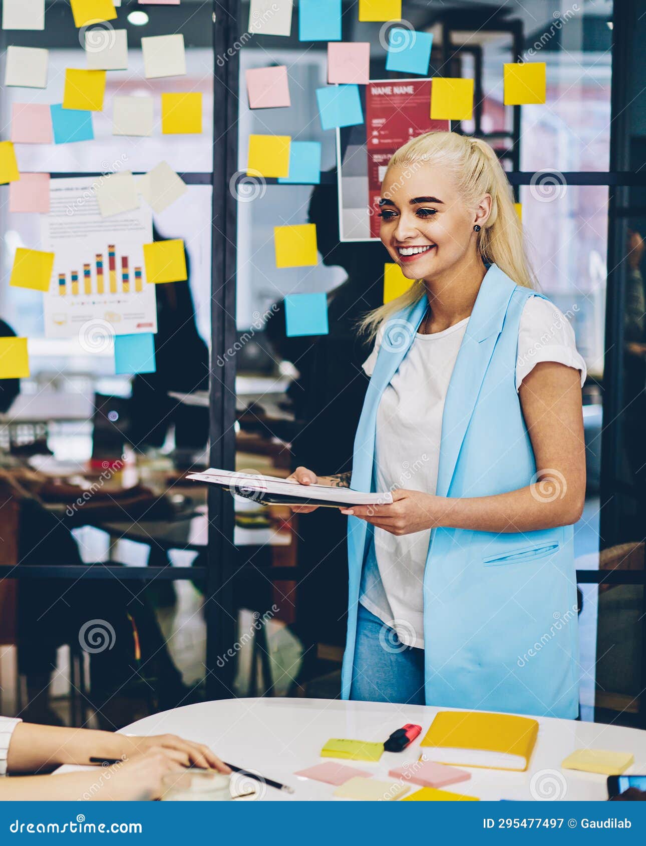 Smiling Young Female Coach Communicating with Multiracial Students ...