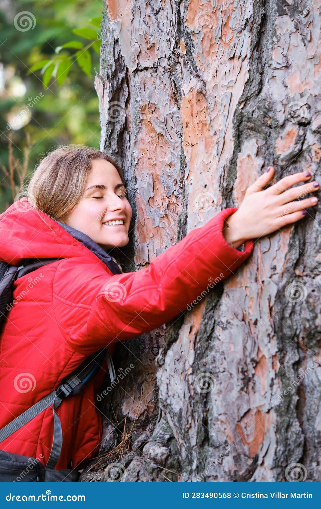 Smiling Environmentalist Hugging a Tree in the Forest. Stock Photo ...