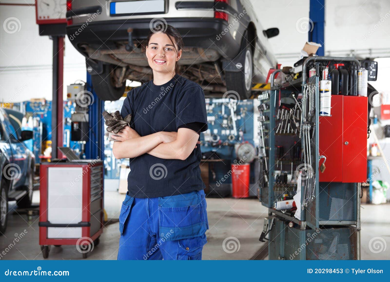 Smiling Young Female Mechanic in Garage Stock Image - Image of indoors ...