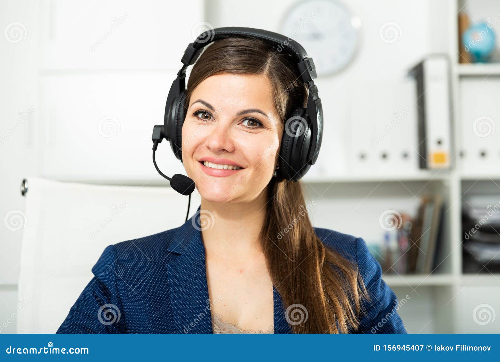 Smiling Female Operator Talking with Customer Using Headset at Company ...