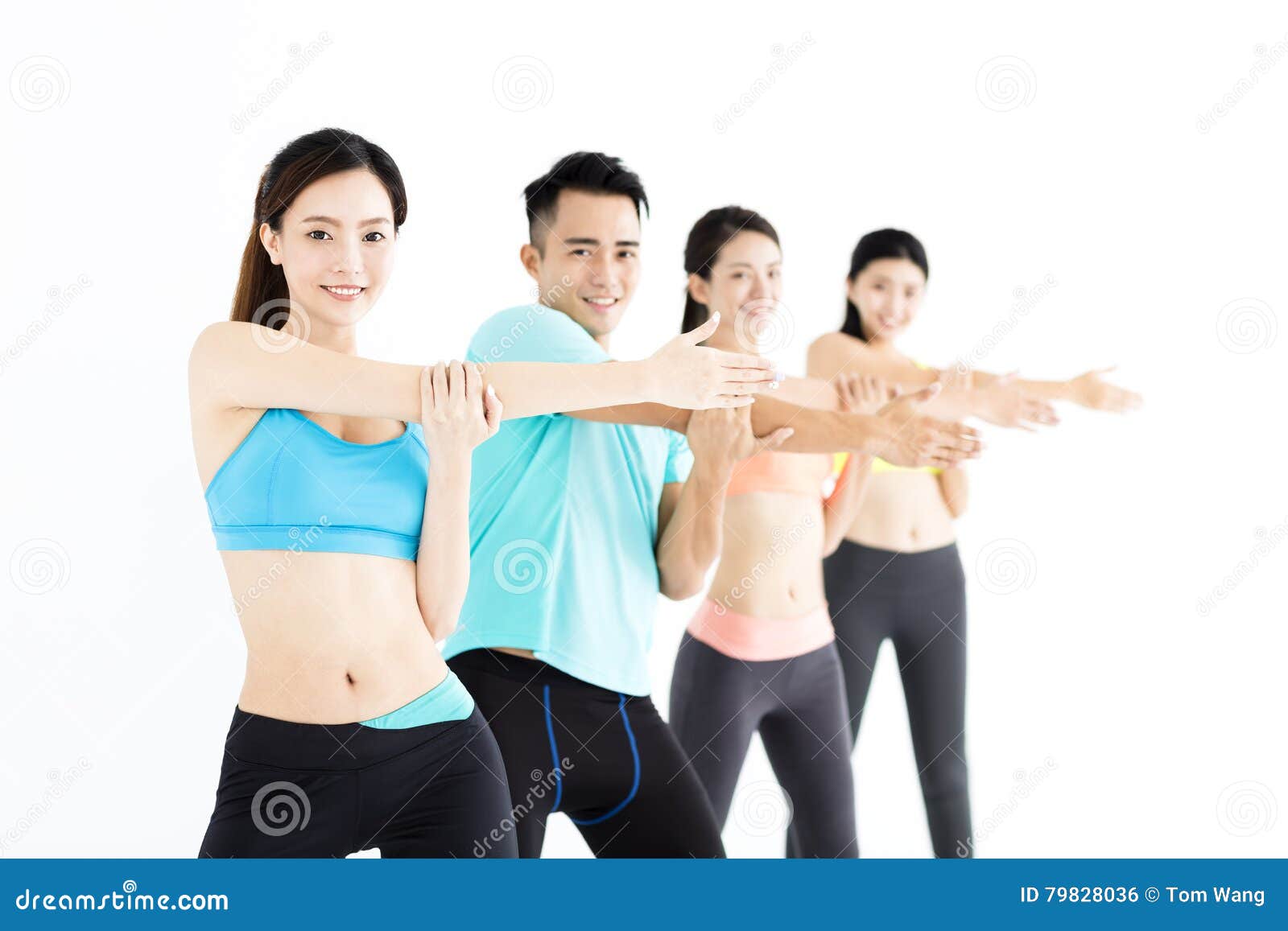 Smiling Young Fit Group Stretching in Gym Stock Photo - Image of hand ...