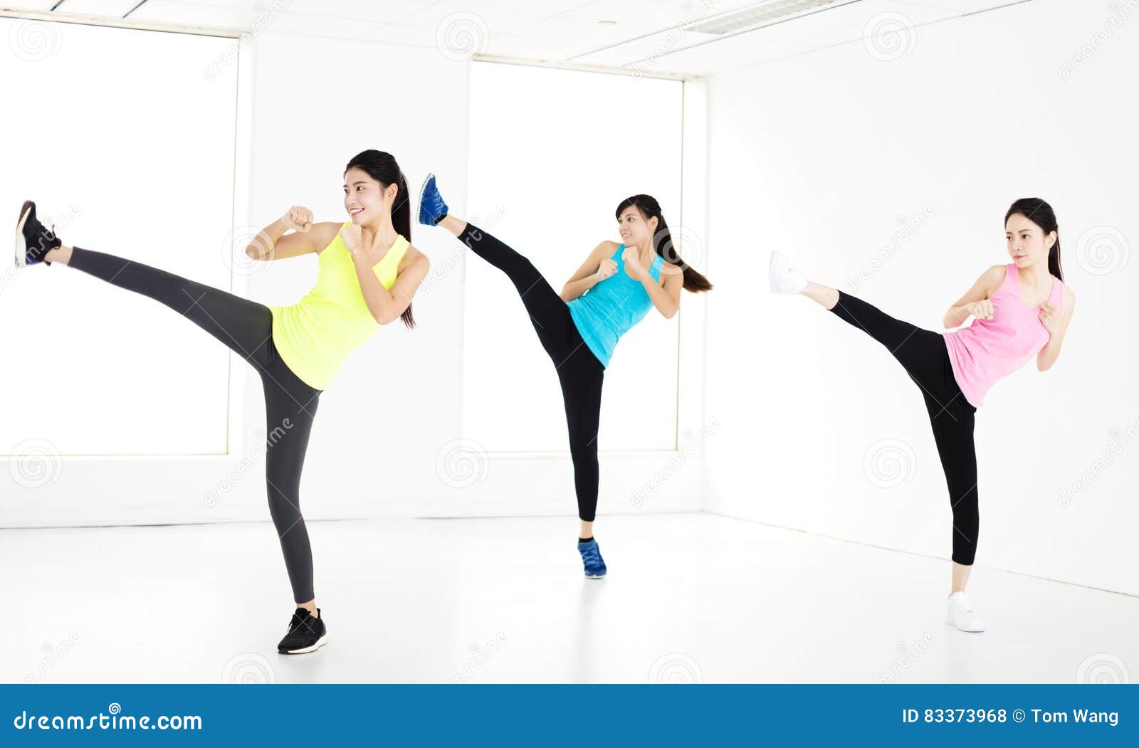 Smiling Young Fit Group Stretching and Kick Stock Photo - Image of kick ...