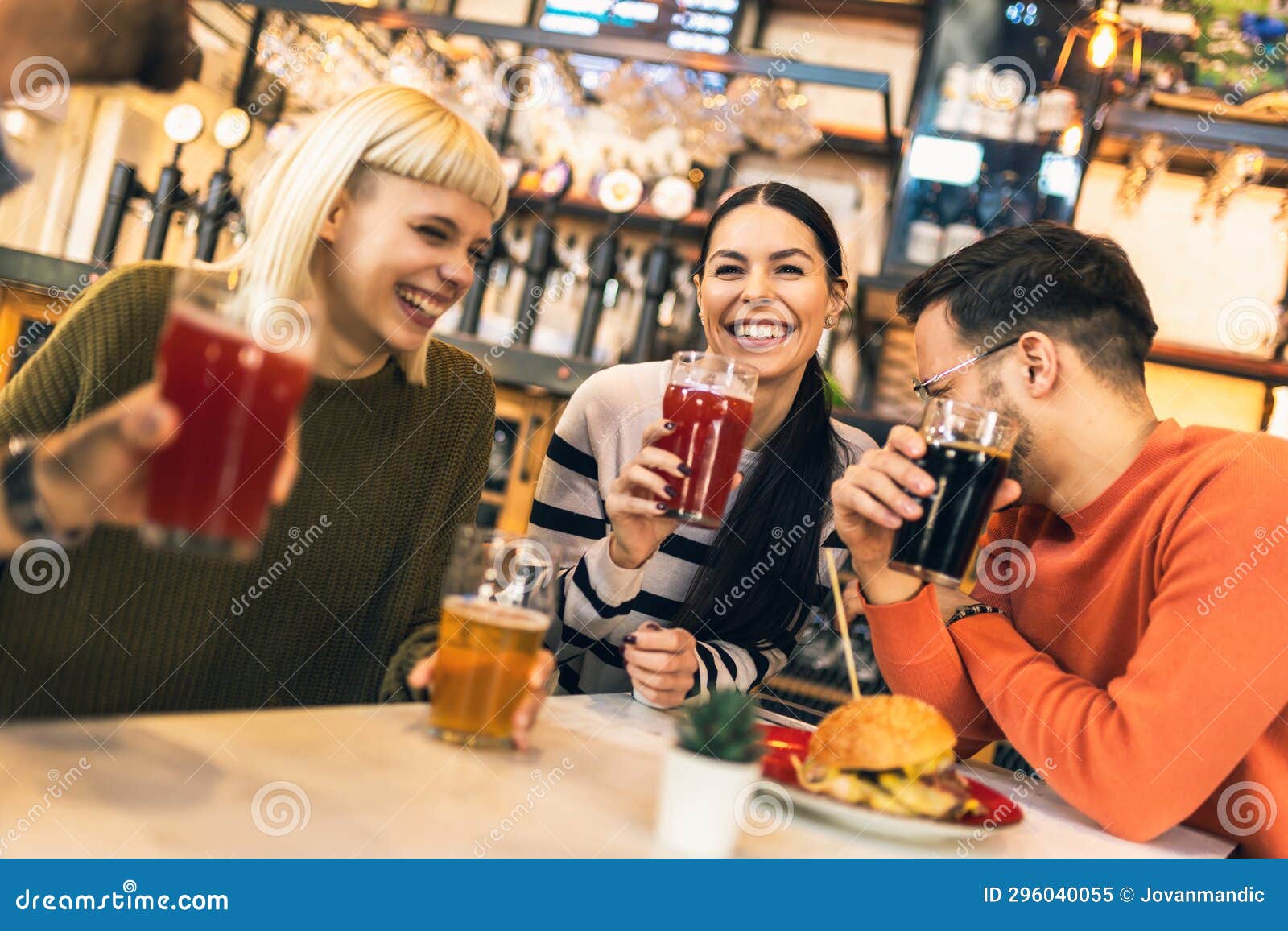 Young Friends Drinking Craft Beer in Pub Stock Image - Image of people, glasses: 296040055