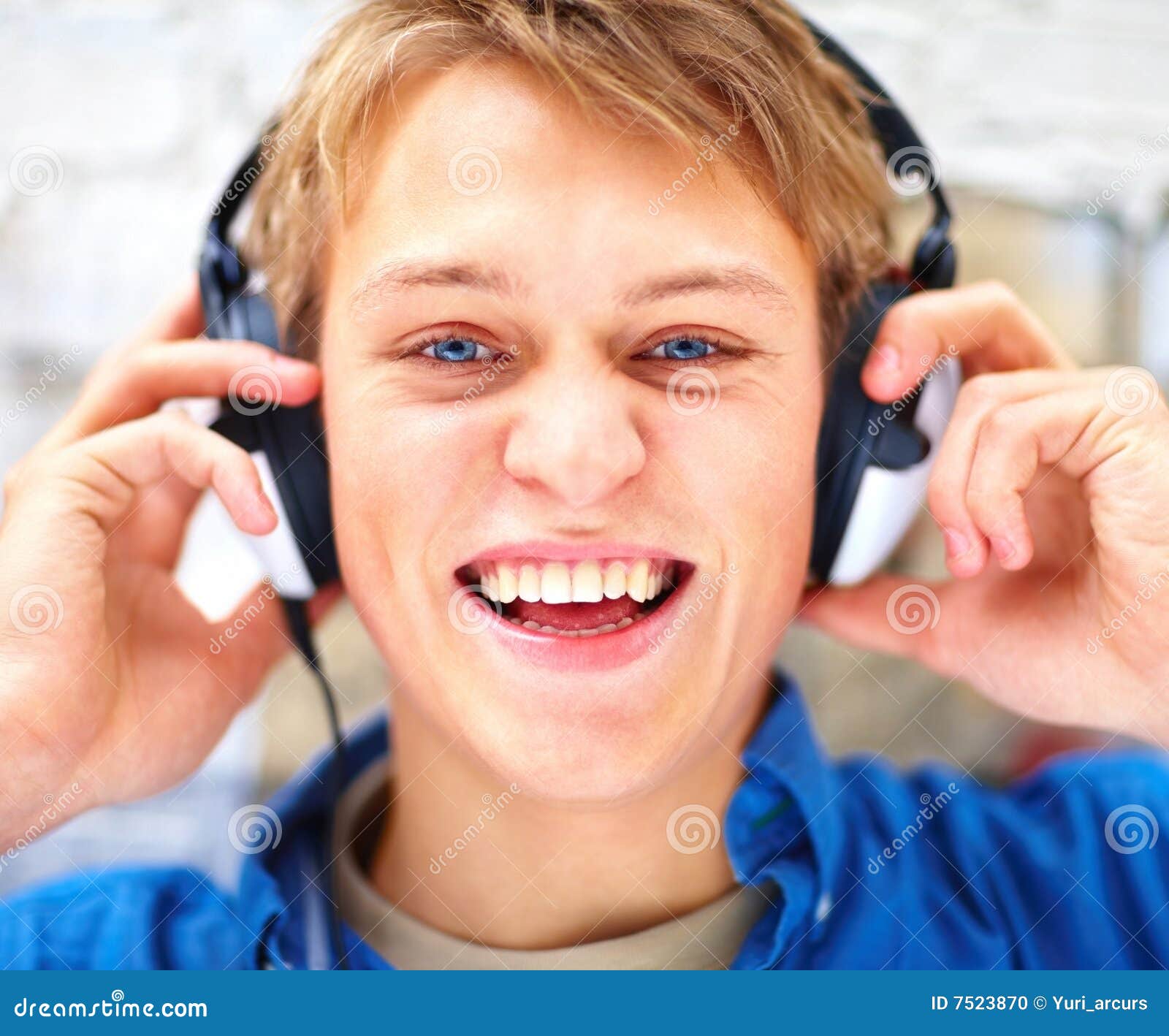 Smiling Young Guy Listening To Music Stock Photo - Image of hair, head ...