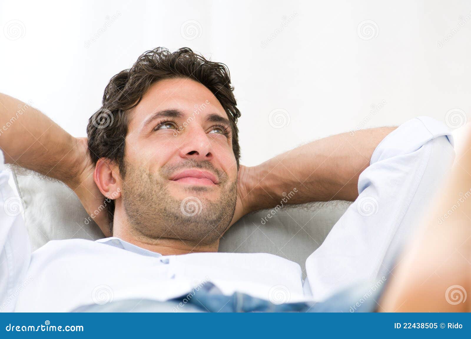 Smiling young guy relaxing stock image. Image of daydreaming - 22438505