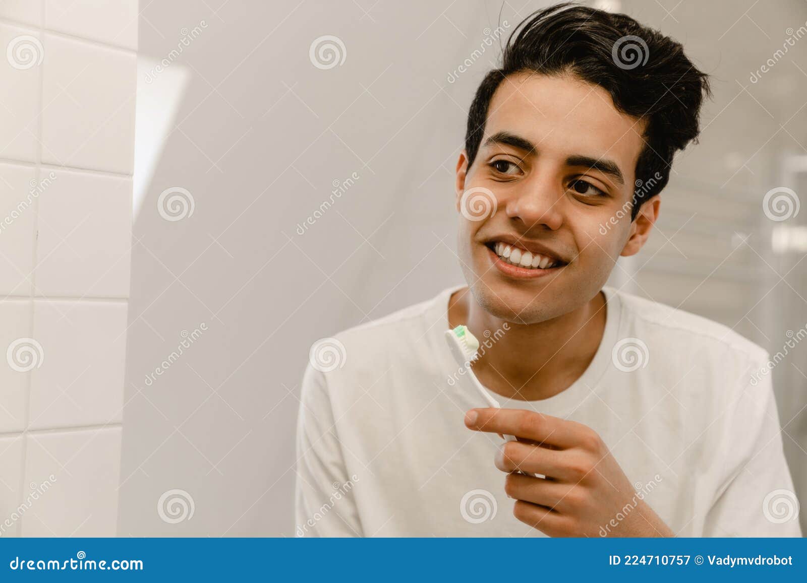 Smiling Young Hispanic Man Brushing Teeth Stock Image - Image of dental ...