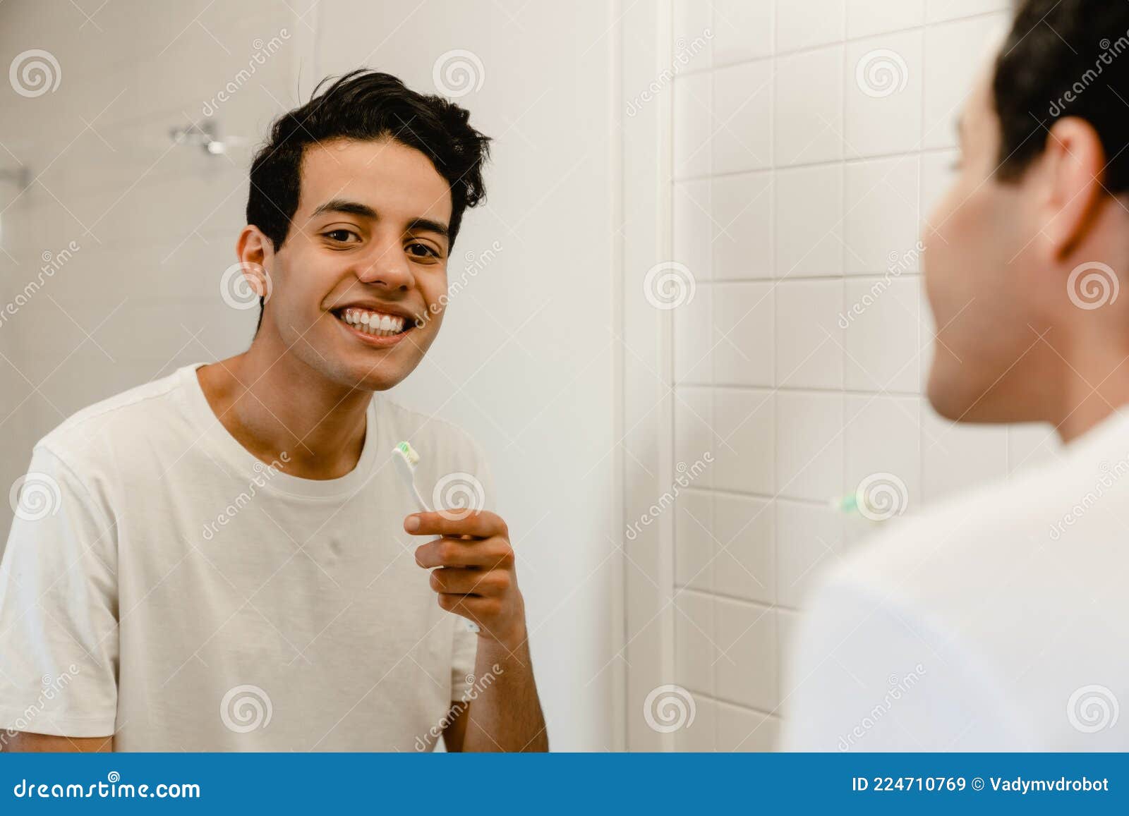 Smiling Young Hispanic Man Brushing Teeth Stock Image - Image of ...