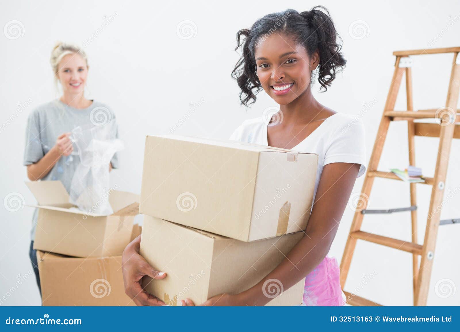 Smiling Young Housemates Moving into New Home Stock Image - Image of ...