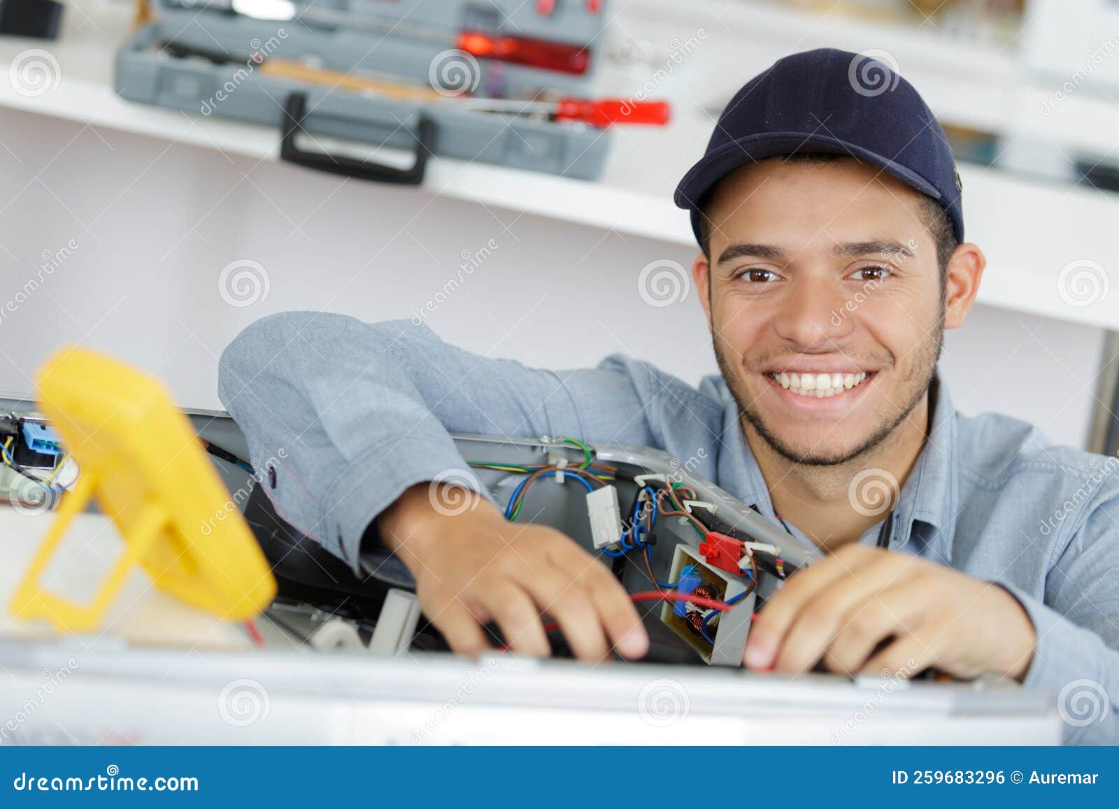 Smiling young male worker stock photo. Image of workingman - 259683296