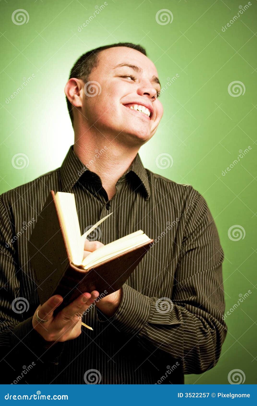 Smiling Young Man with Book Stock Image - Image of grinning, hispanic ...