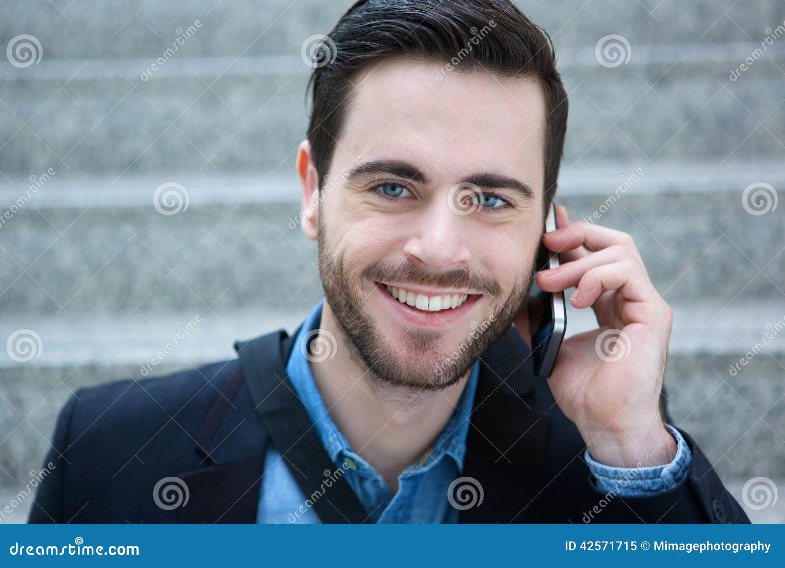 Smiling Young Man Calling by Mobile Phone Stock Image - Image of ...