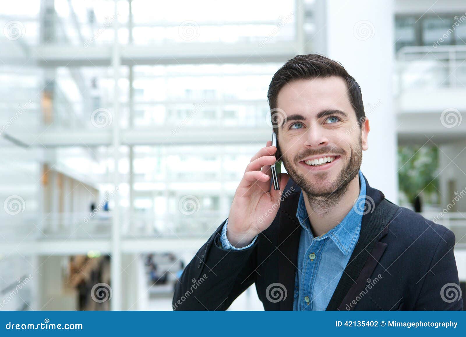 Smiling Young Man Calling by Phone Stock Photo - Image of friendly ...