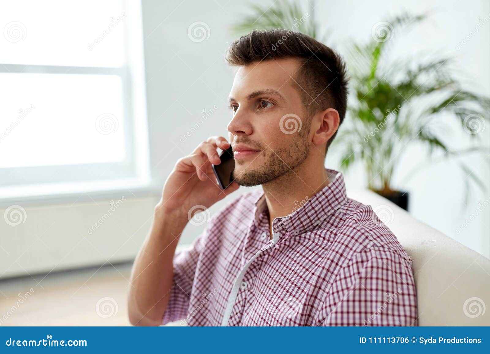 Smiling Young Man Calling on Smartphone at Office Stock Photo - Image ...