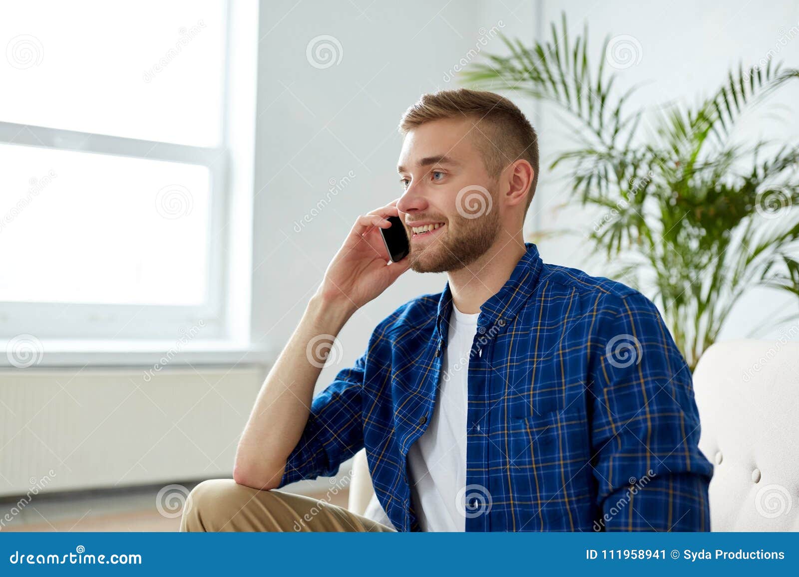 Smiling Young Man Calling on Smartphone at Office Stock Image - Image ...