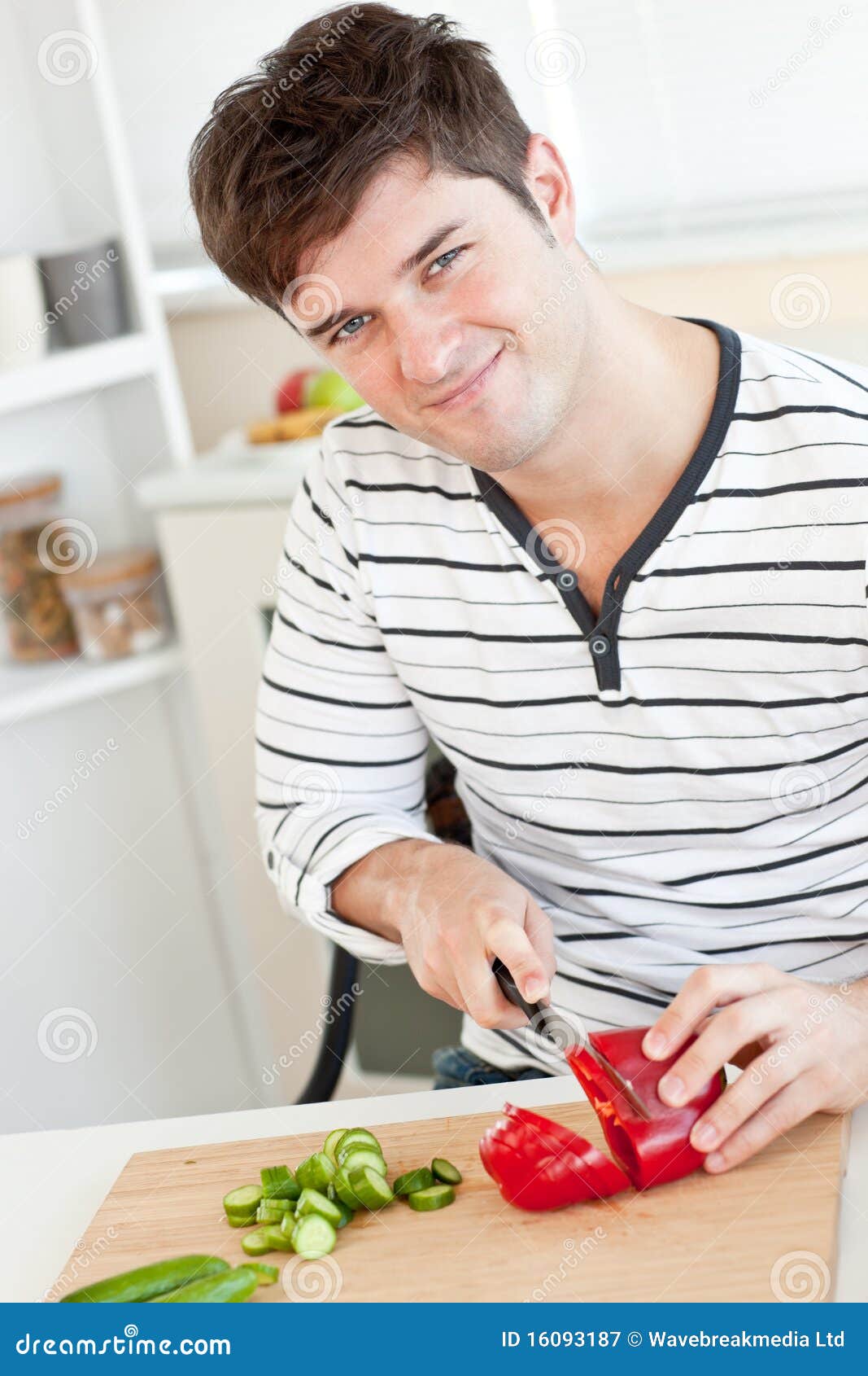 Smiling Young Man Cutting Vegetables Stock Image - Image of paprika ...