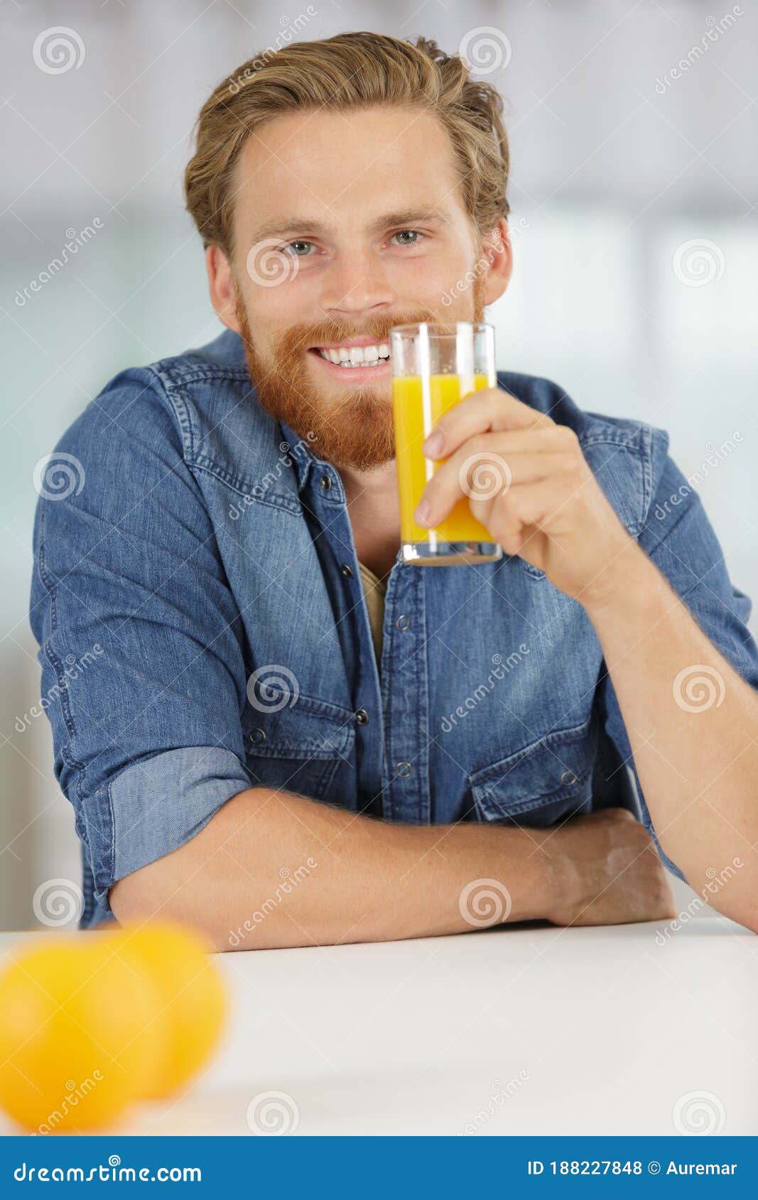 Smiling Young Man Drinking Orange Juice Stock Photo - Image of cafes ...