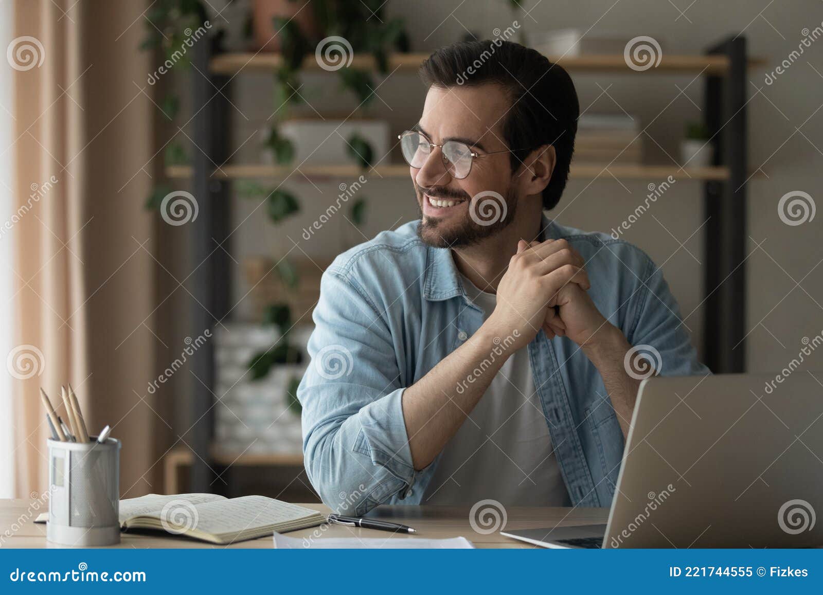 Smiling Young Man in Eyeglasses Distracted from Computer Work. Stock ...