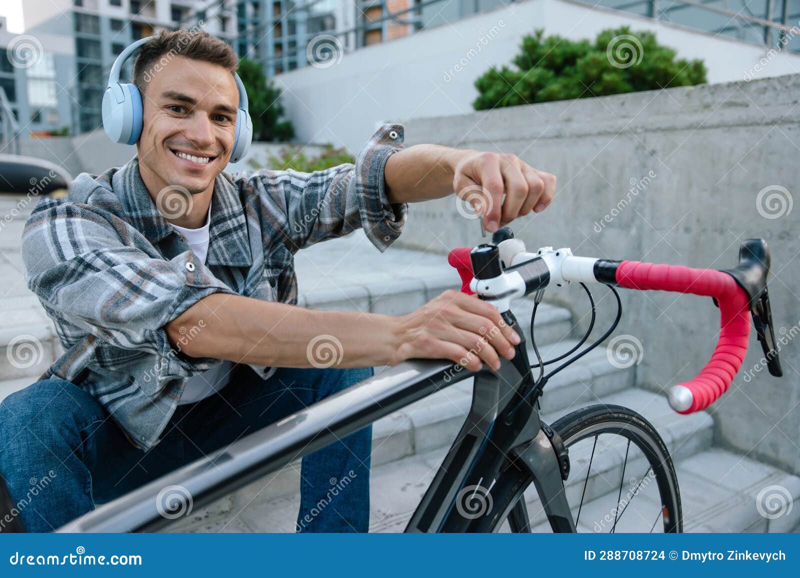 Smiling Young Man Fixing a Problem with the Bike Stock Photo - Image of ...