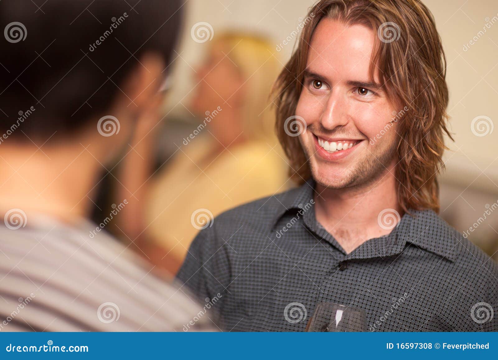 Smiling Young Man with Glass of Wine Socializing Stock Photo - Image of ...