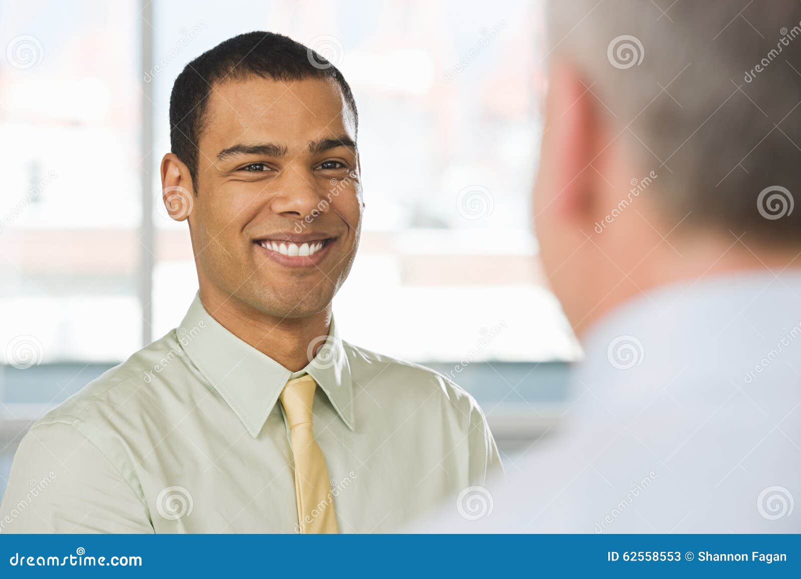 Smiling Young Man in an Interview Stock Image - Image of clean, focus ...