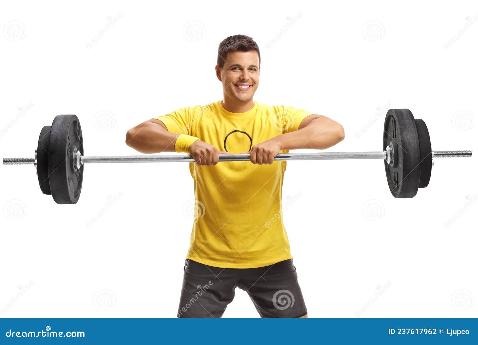 Smiling Young Man Lifting Weights Stock Photo - Image of single ...