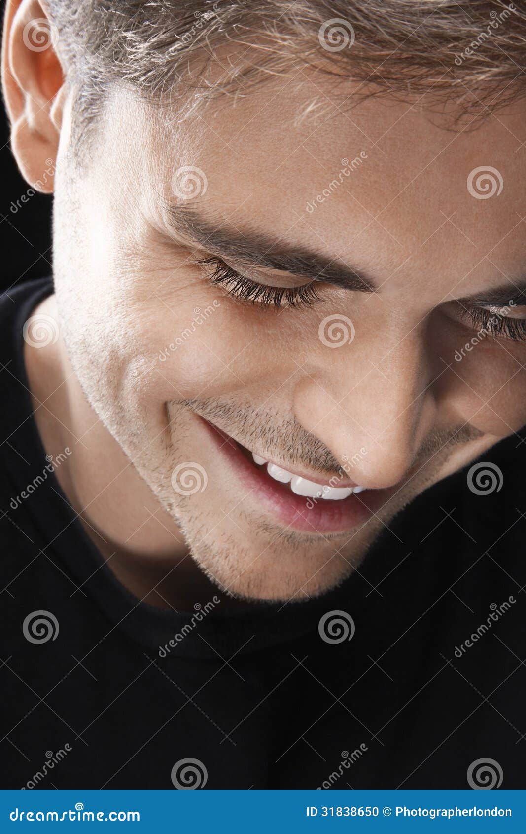 Smiling Young Man Looking Down Stock Photo - Image of smart, looking ... Smiling Young Man Looking Down Stock Photo - Image of smart, looking ...
