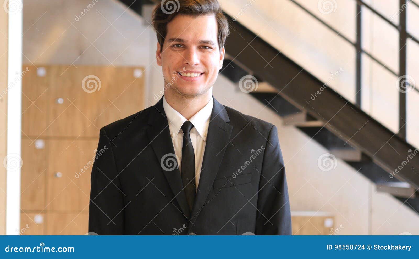 Smiling Young Man in Suit stock photo. Image of lifestyle - 98558724