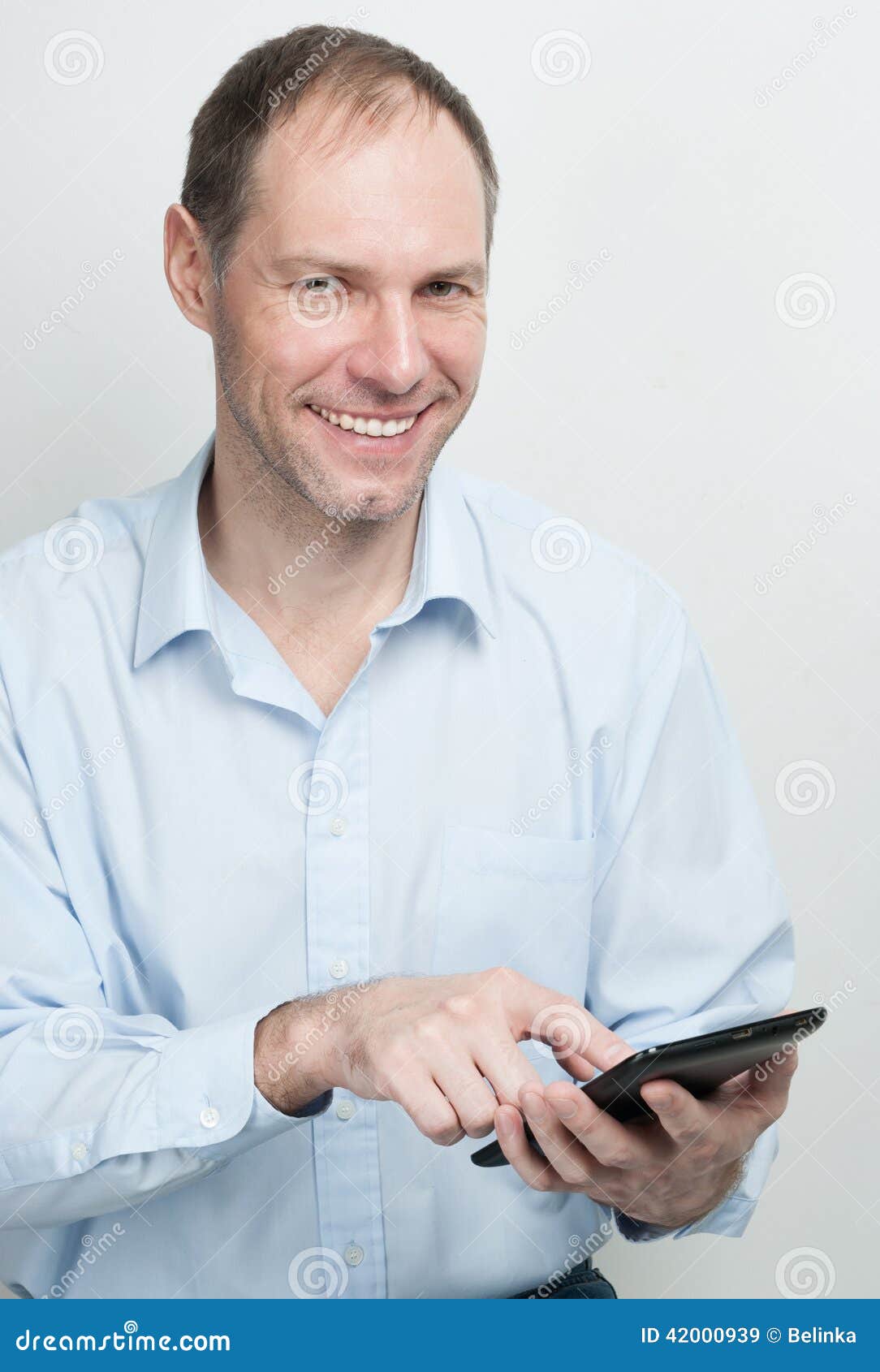 Smiling Young Man With Tablet Computer On White Background Stock Image