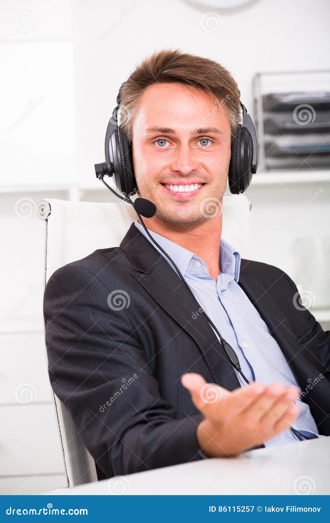 Smiling Young Man Talking on Headset at Office Stock Image - Image of ...