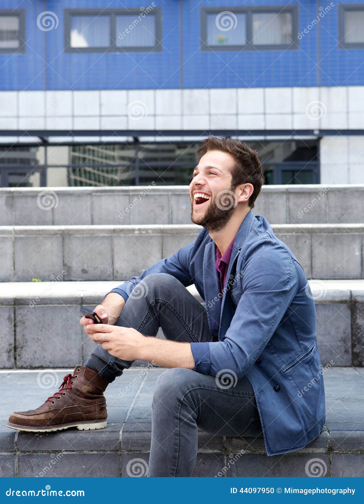 Smiling Young Man Text Messaging on Cellphone Stock Photo - Image of ...