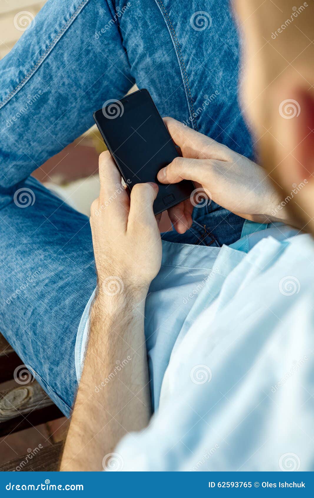 Smiling Young Man Texting on the Cellphone Stock Image - Image of relax ...