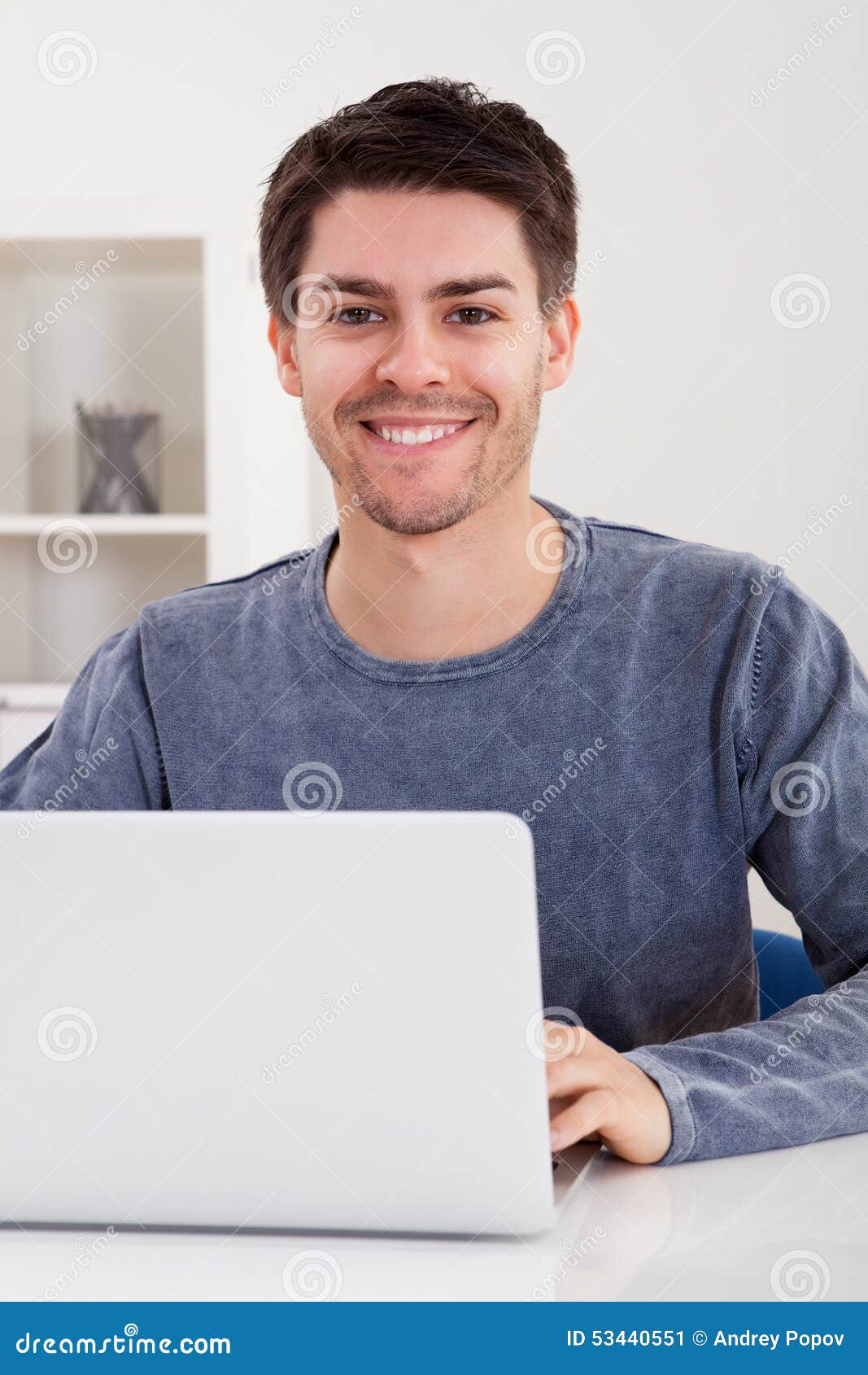 Smiling Young Man Using a Laptop Stock Image - Image of happy, desk ...