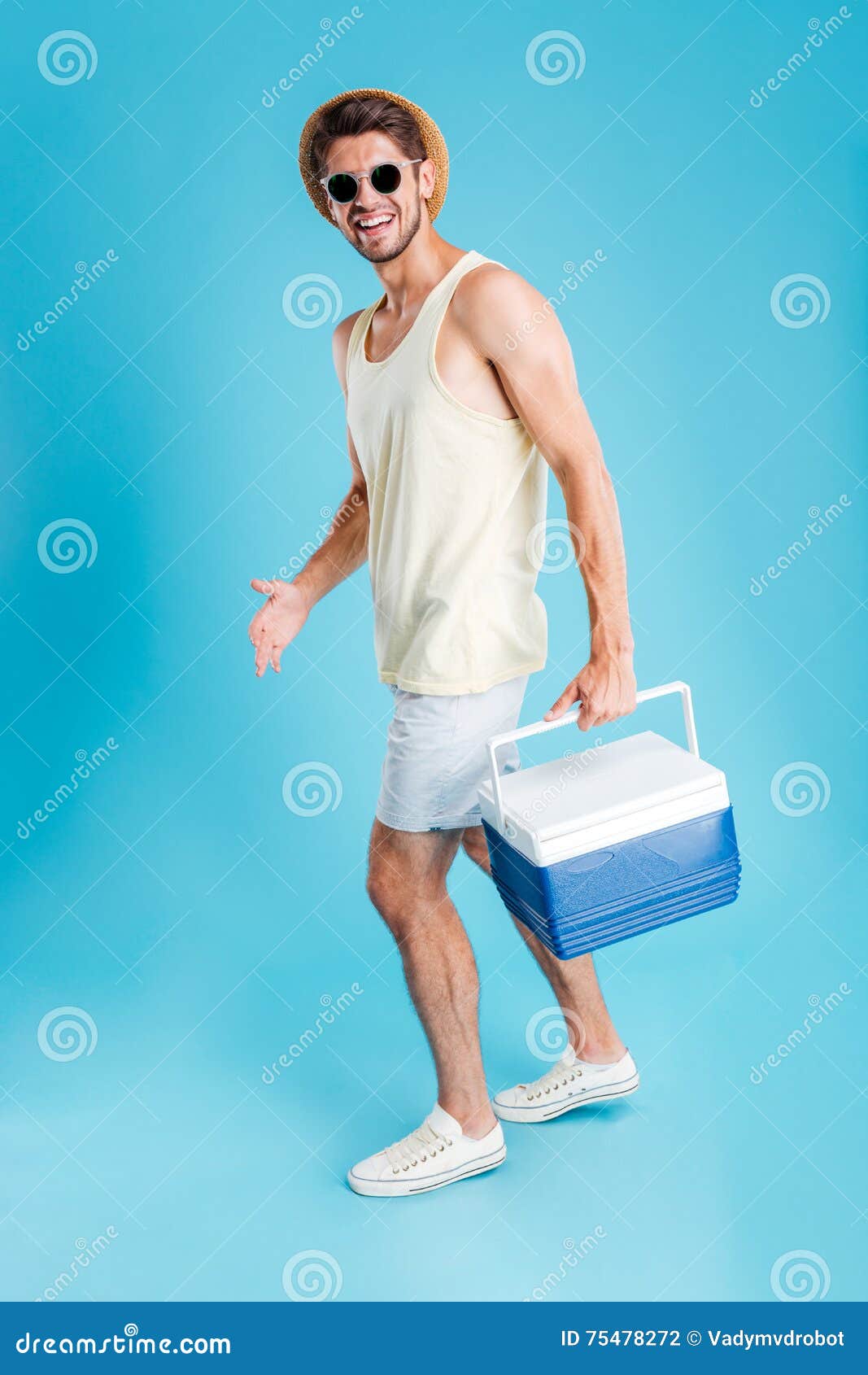 Smiling Young Man Walking and Holding Cooler Bag Stock Photo - Image of ...