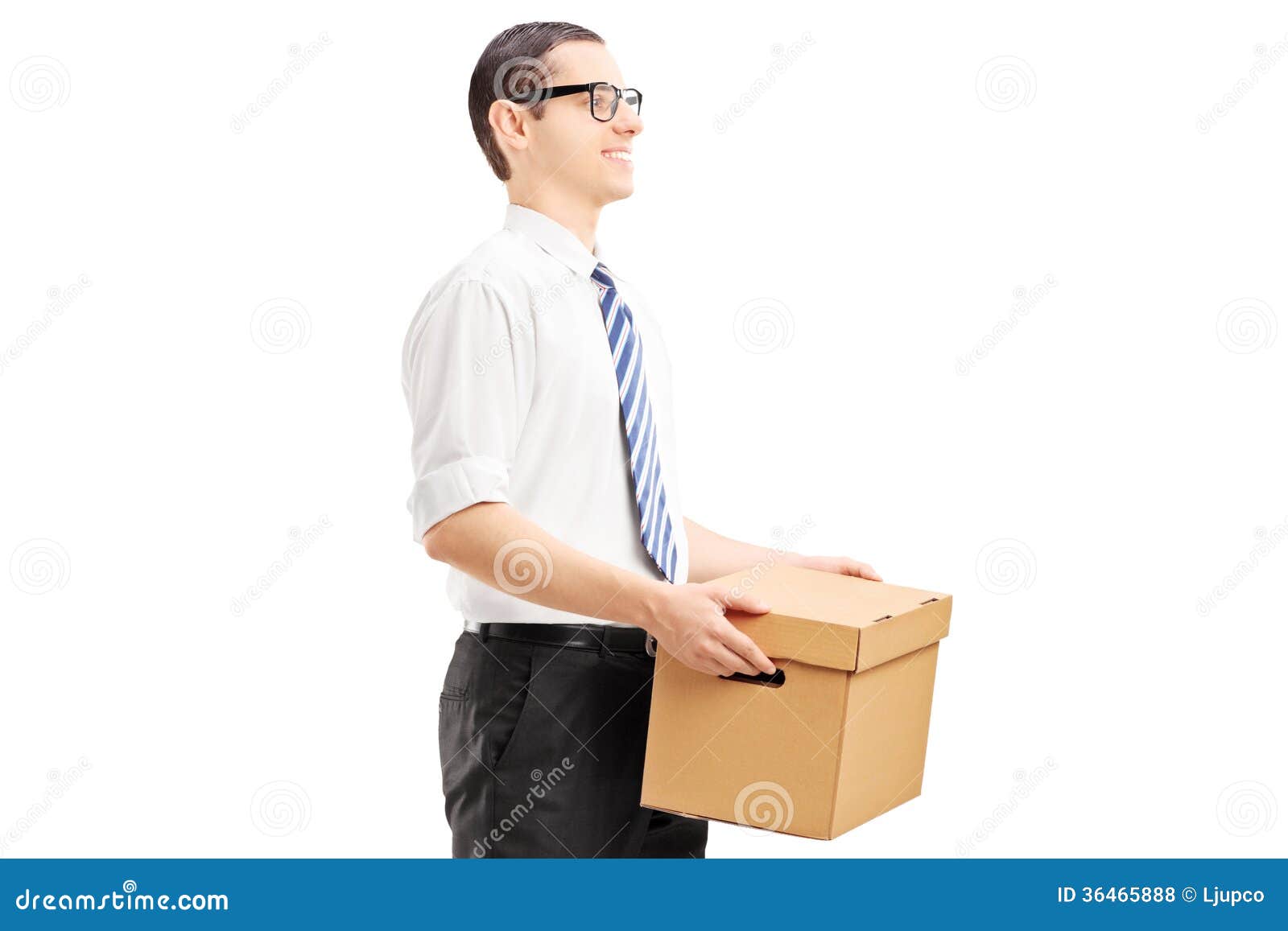 Smiling Young Man Walking with a Paper Box in His Hands Stock Photo ...